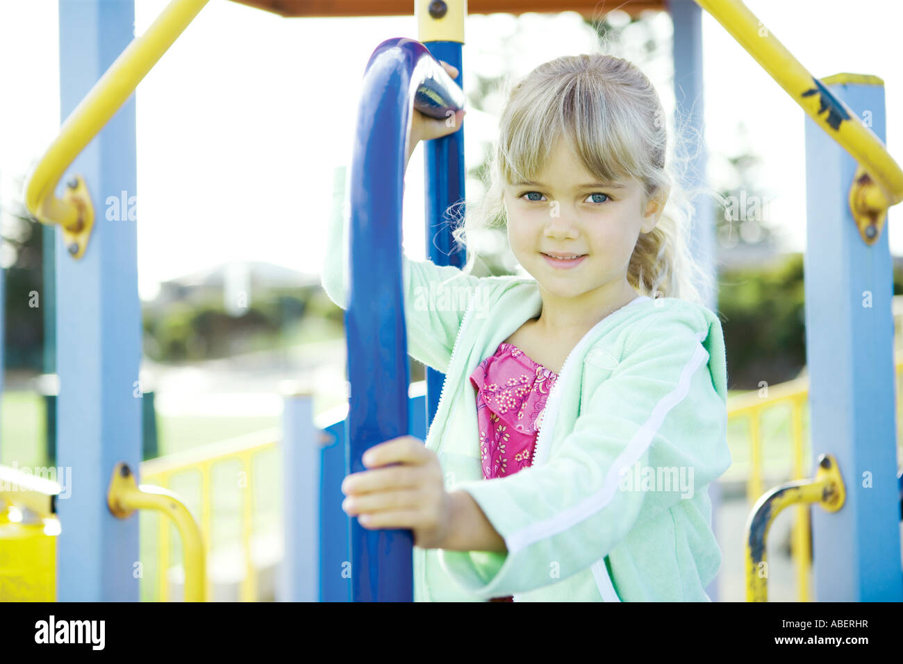 Child on playground equipment Stock Photo - Alamy