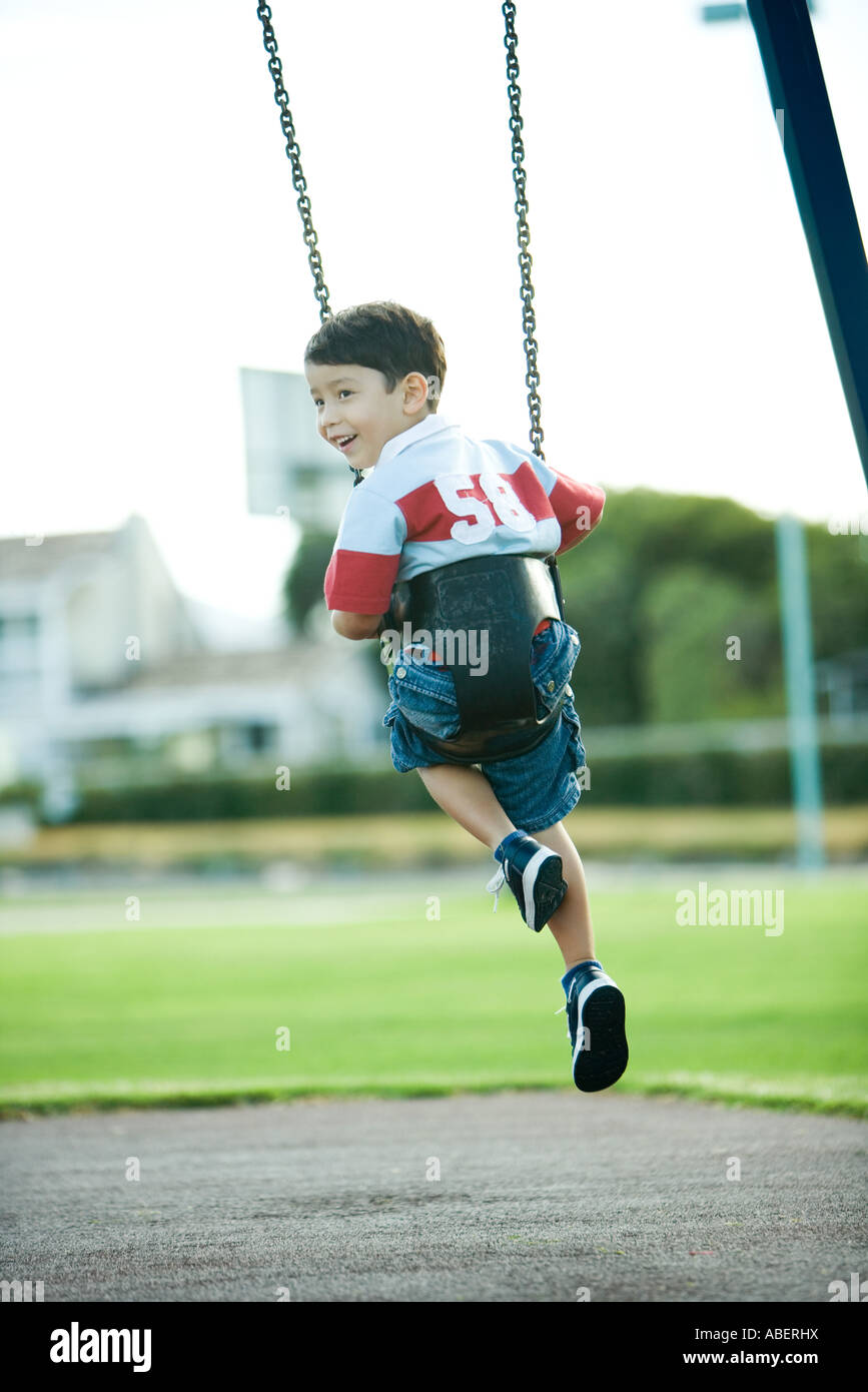 Child on swing Stock Photo - Alamy