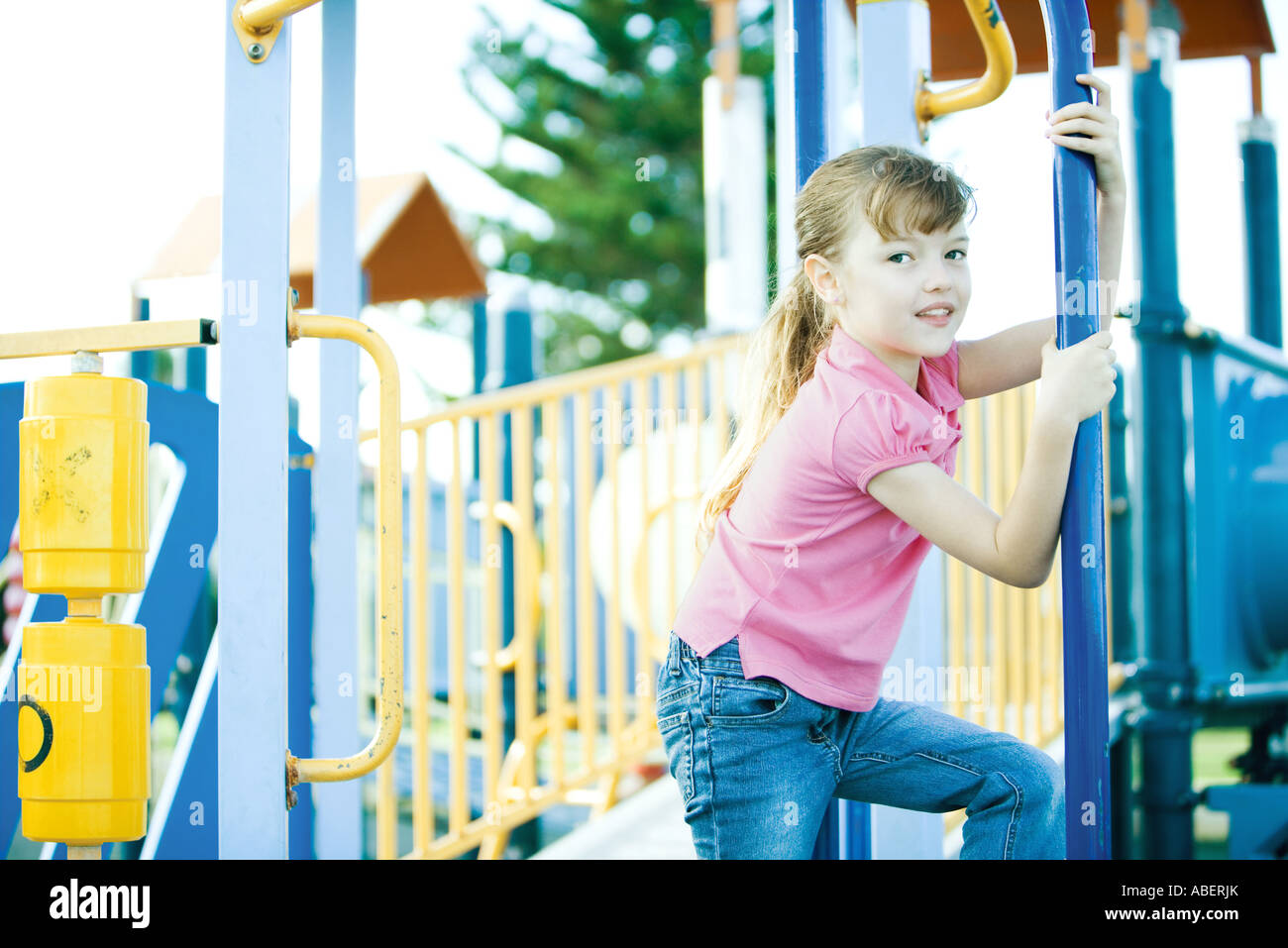Child on playground equipment Stock Photo - Alamy