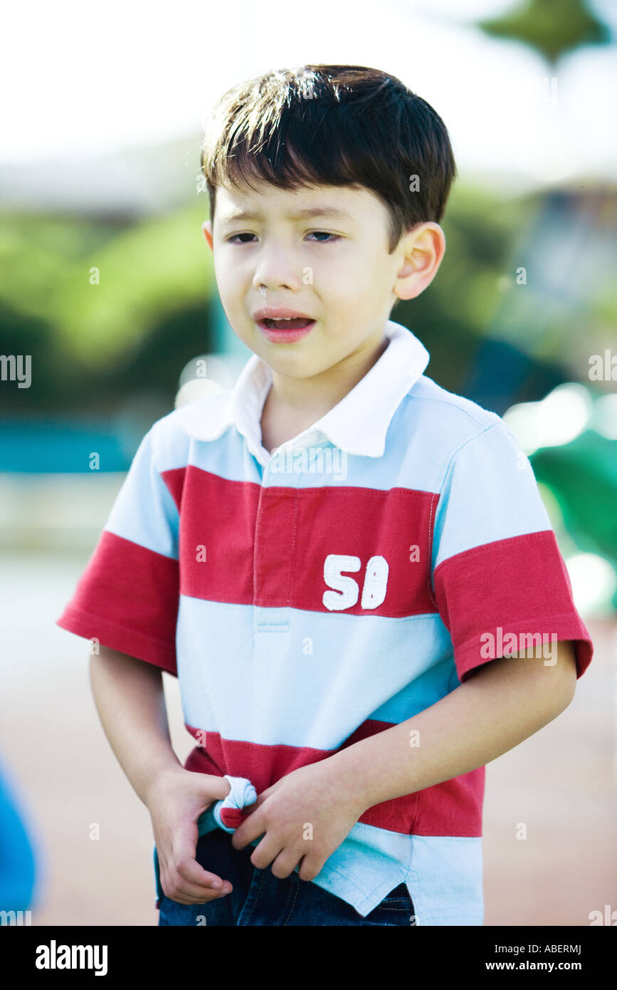 Boy crying on playground Stock Photo - Alamy