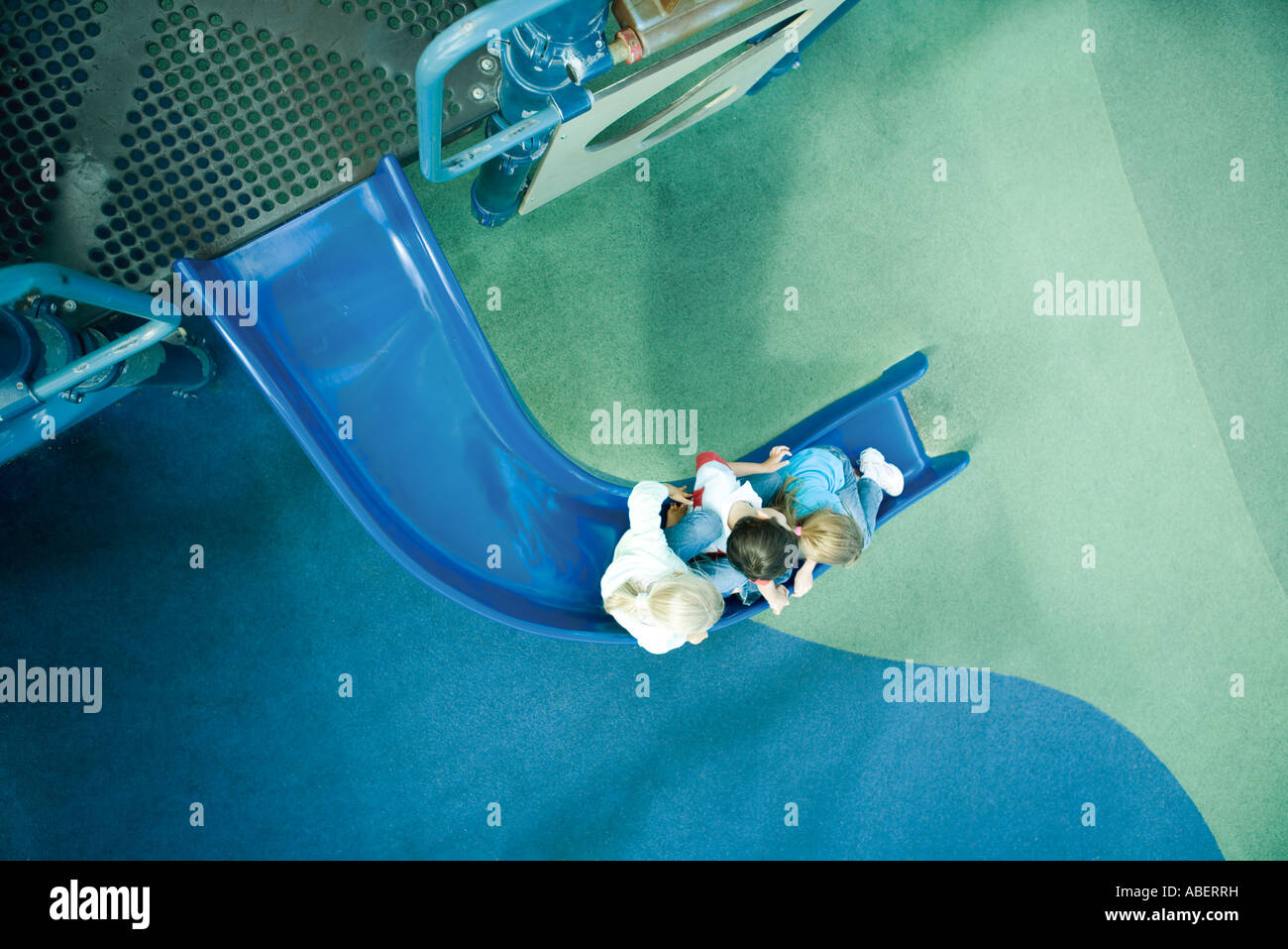 Child going down playground slide hi-res stock photography and images ...
