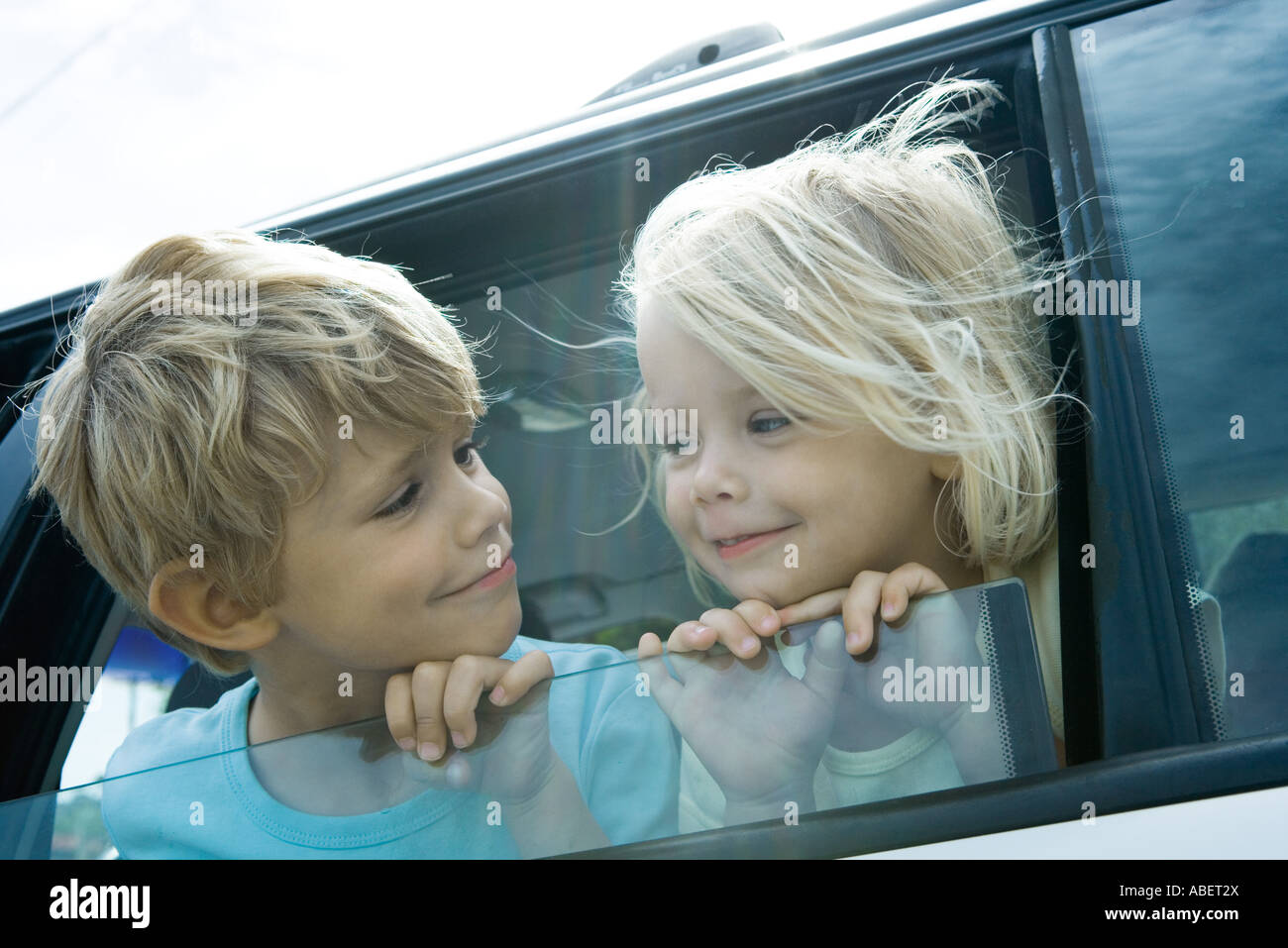 Smiling through car windows hi-res stock photography and images - Alamy