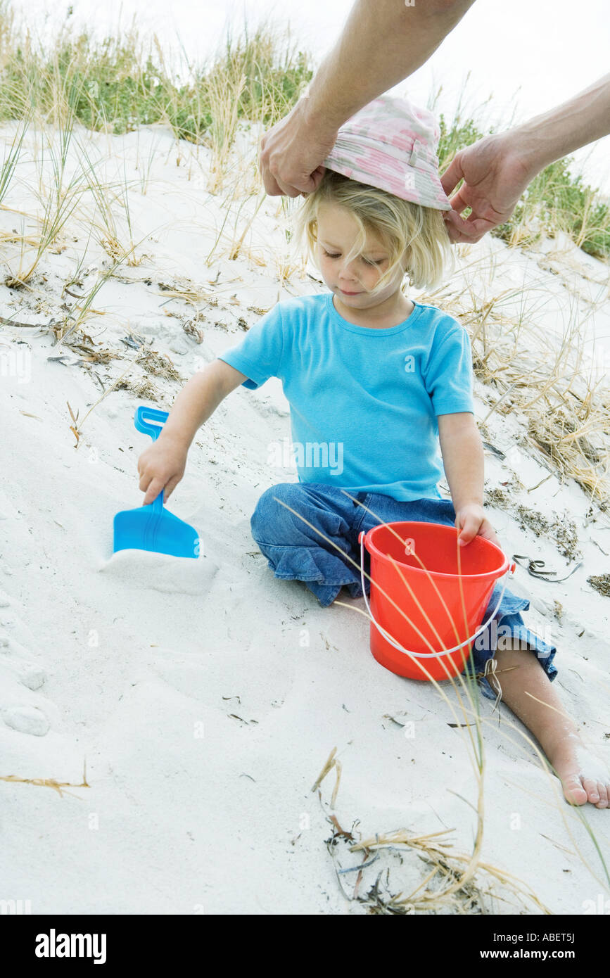 Child playing in sand Stock Photo - Alamy