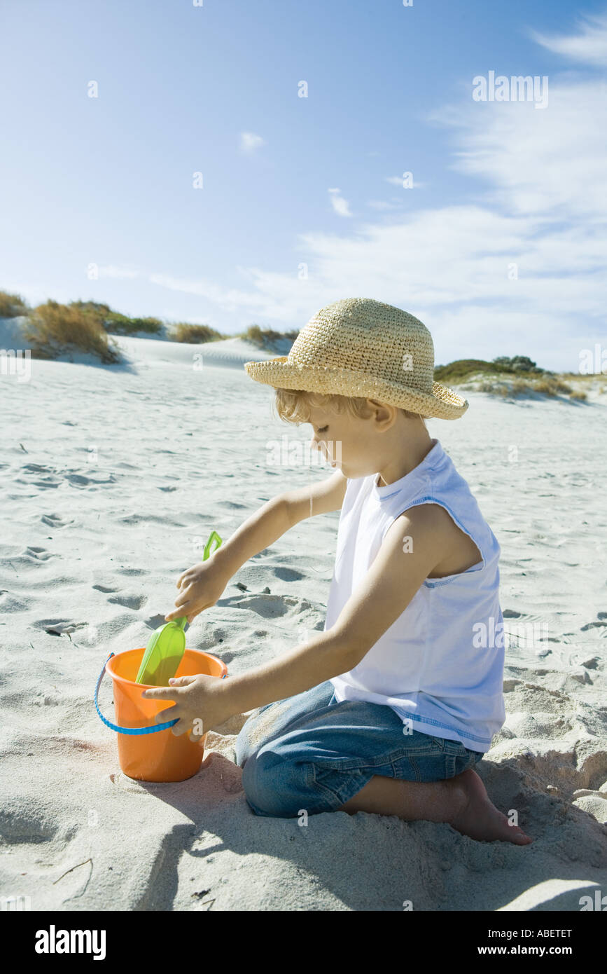 Child playing in sand Stock Photo - Alamy