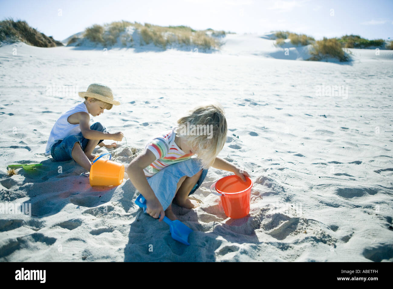 Children playing in sand Stock Photo - Alamy
