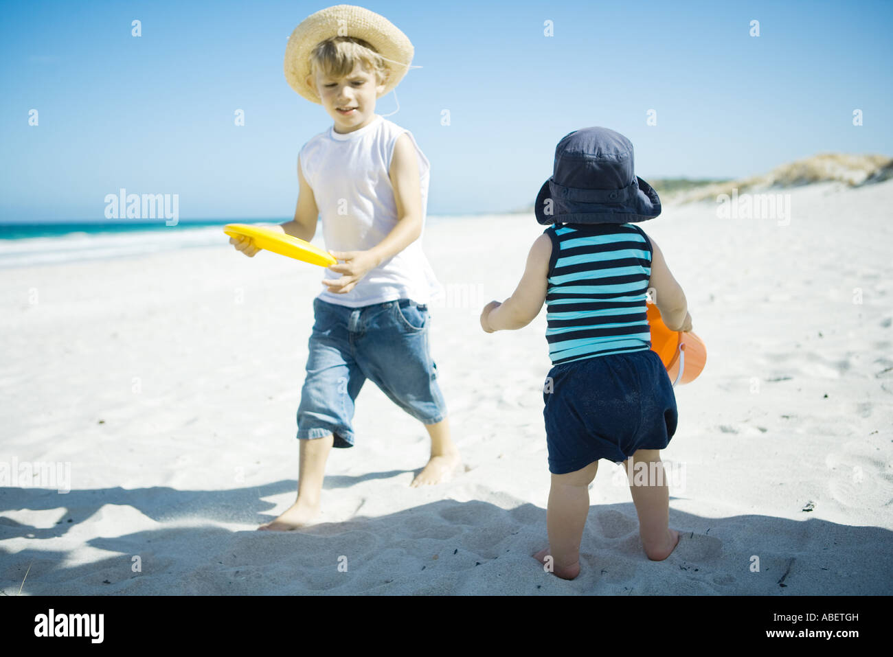 Children playing in sand Stock Photo - Alamy