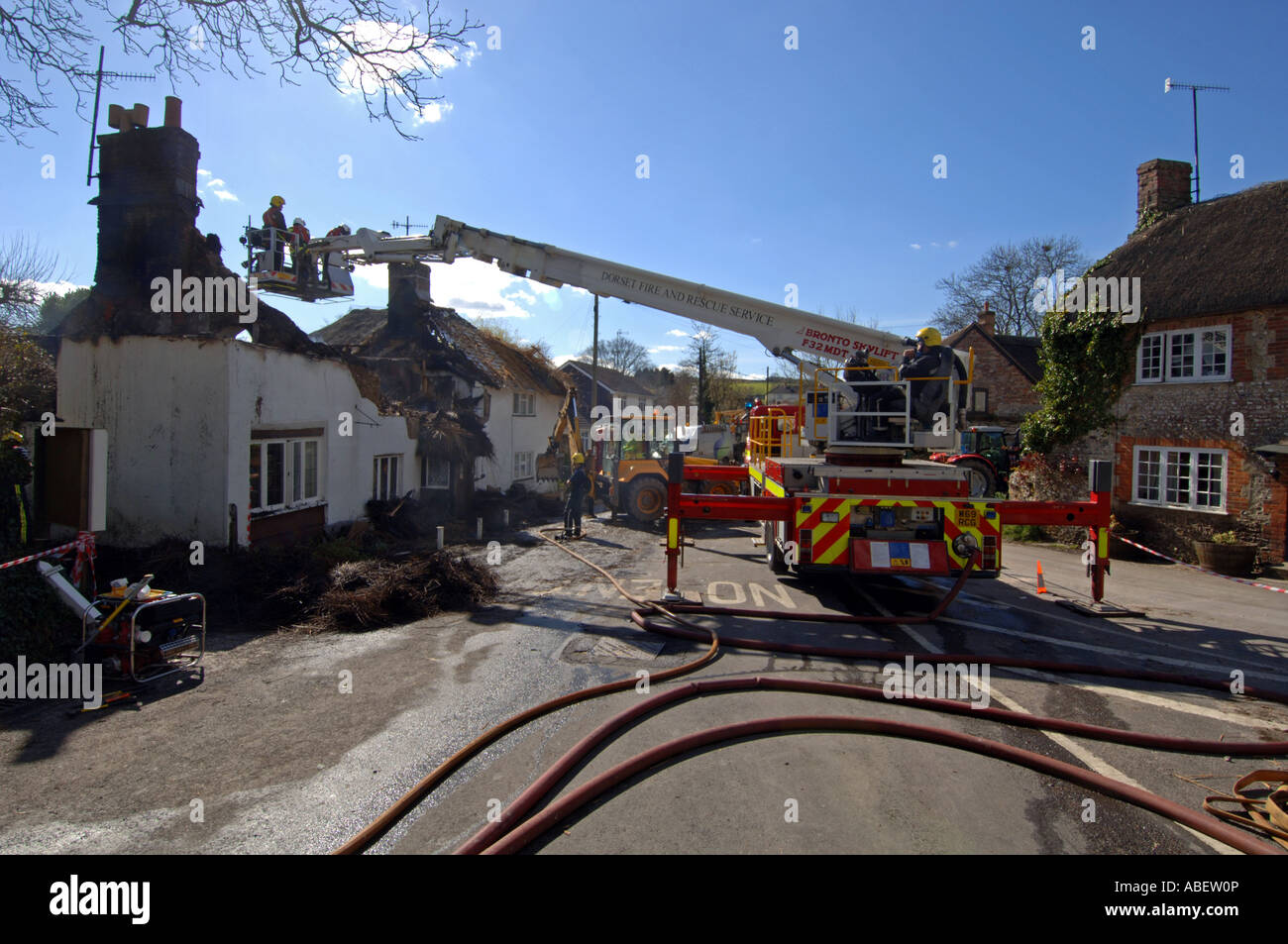 Fire engine outside a burnt out thatched cottage in Piddlehinton ...