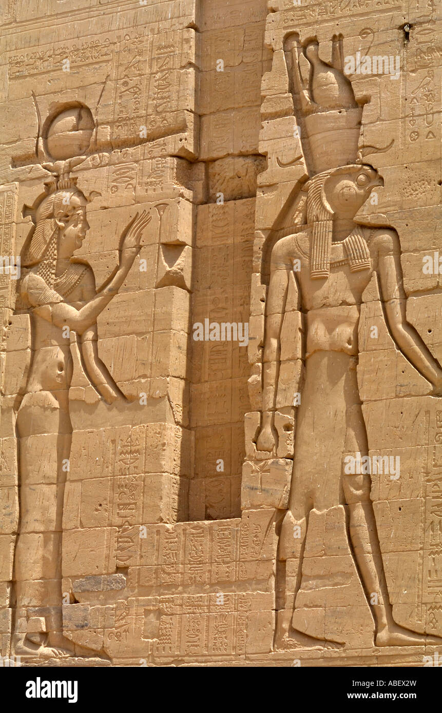 Relief carving showing the Goddess Isis & the Falcon-Headed sun god ...