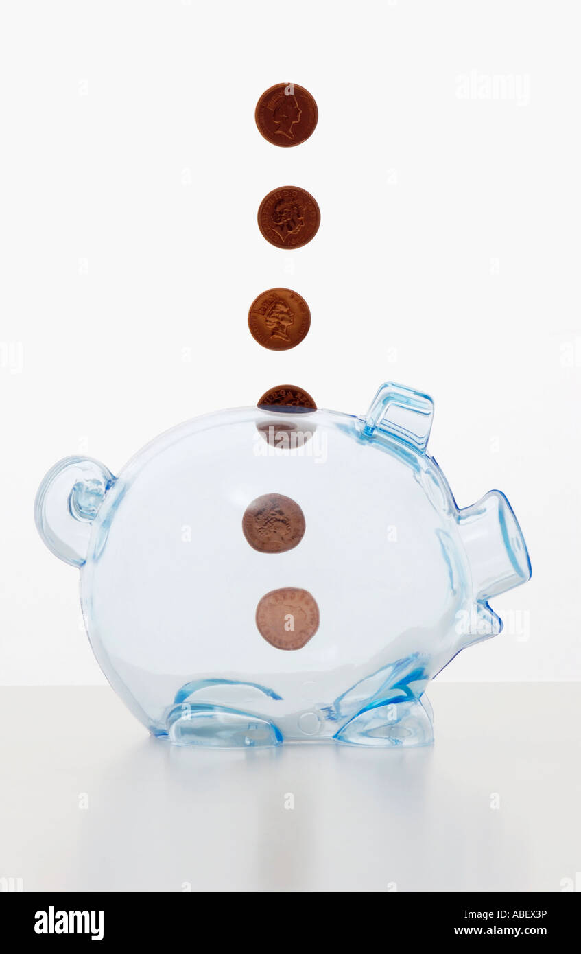 Clear plastic Pig Money Box suspended one penny coins Stock Photo - Alamy