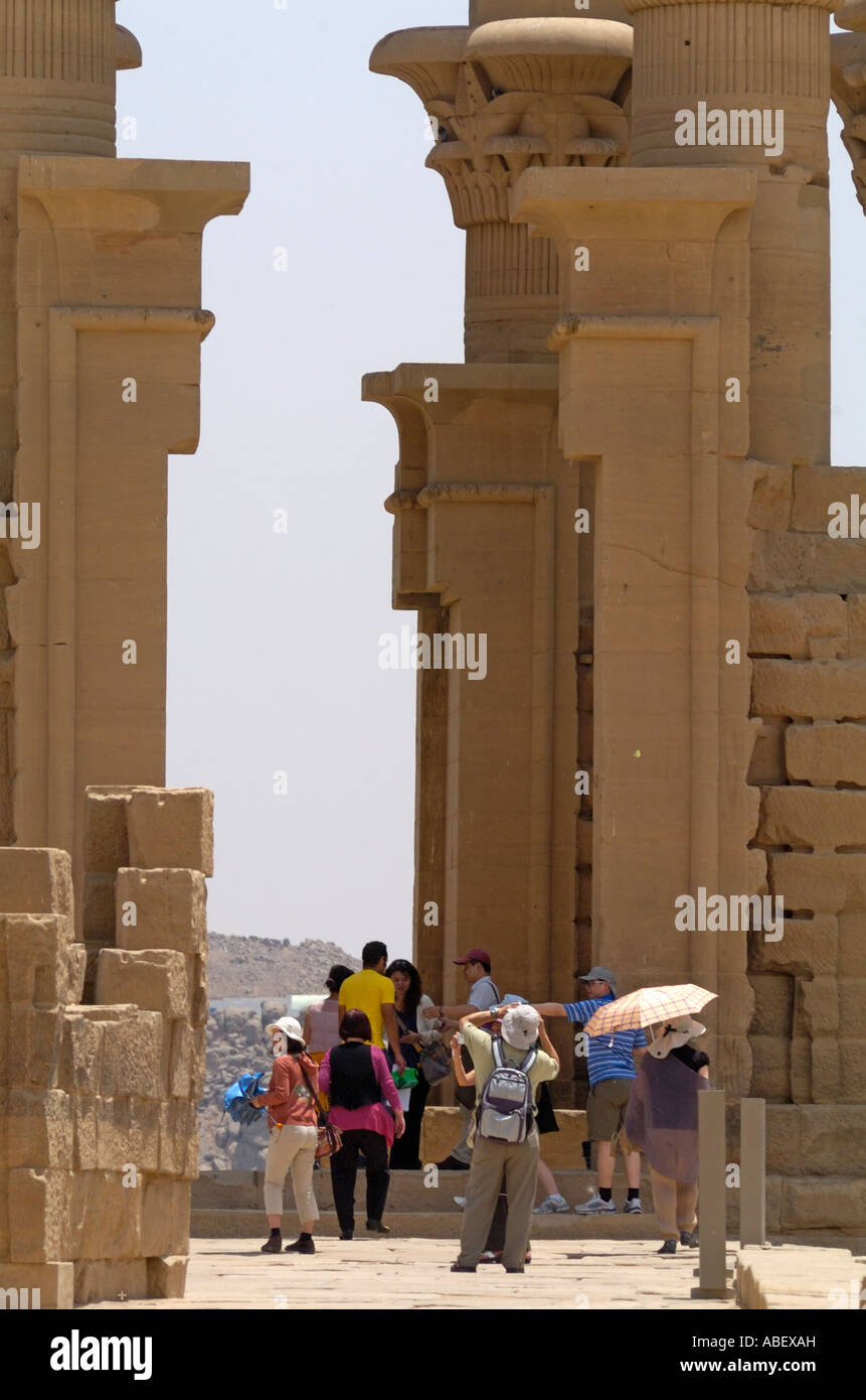Visitors admire the columns at Philae Temple UNESCO World Heritage Site ...