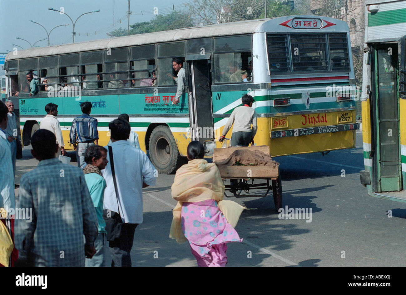 Passengers boarding a bus in India Stock Photo - Alamy