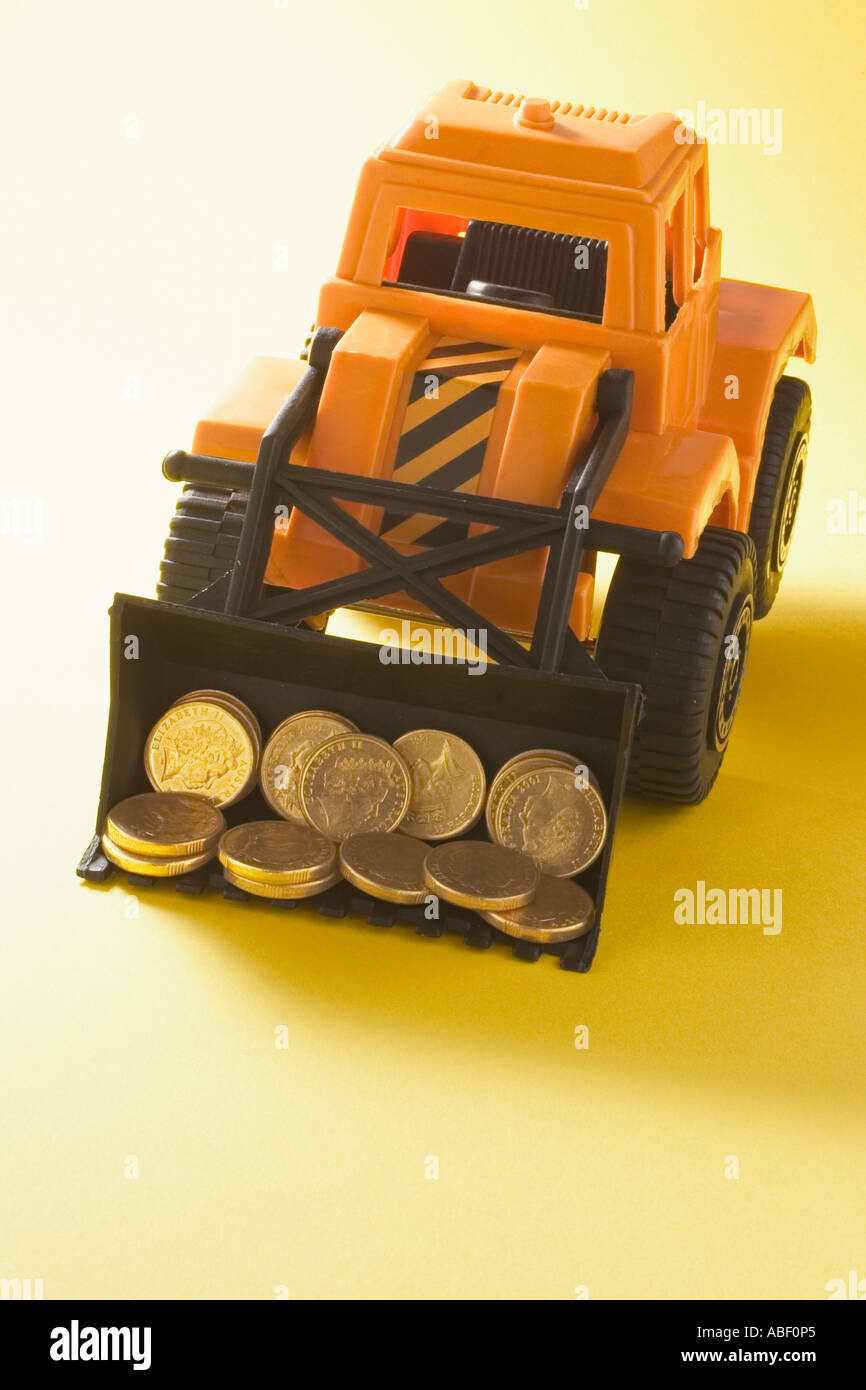 Toy Earthmovers with Coins Stock Photo - Alamy