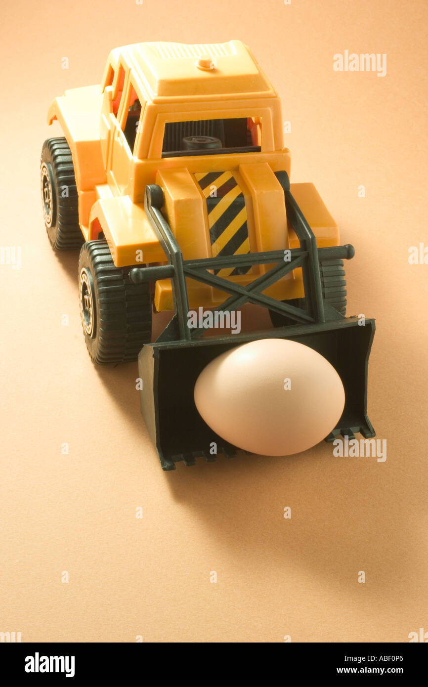 Toy Earthmover with Egg Stock Photo - Alamy