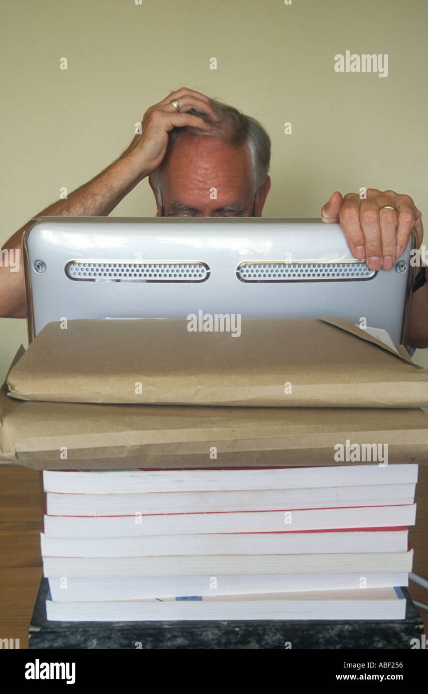 Confused scratching head home working at computer screen Stock Photo ...