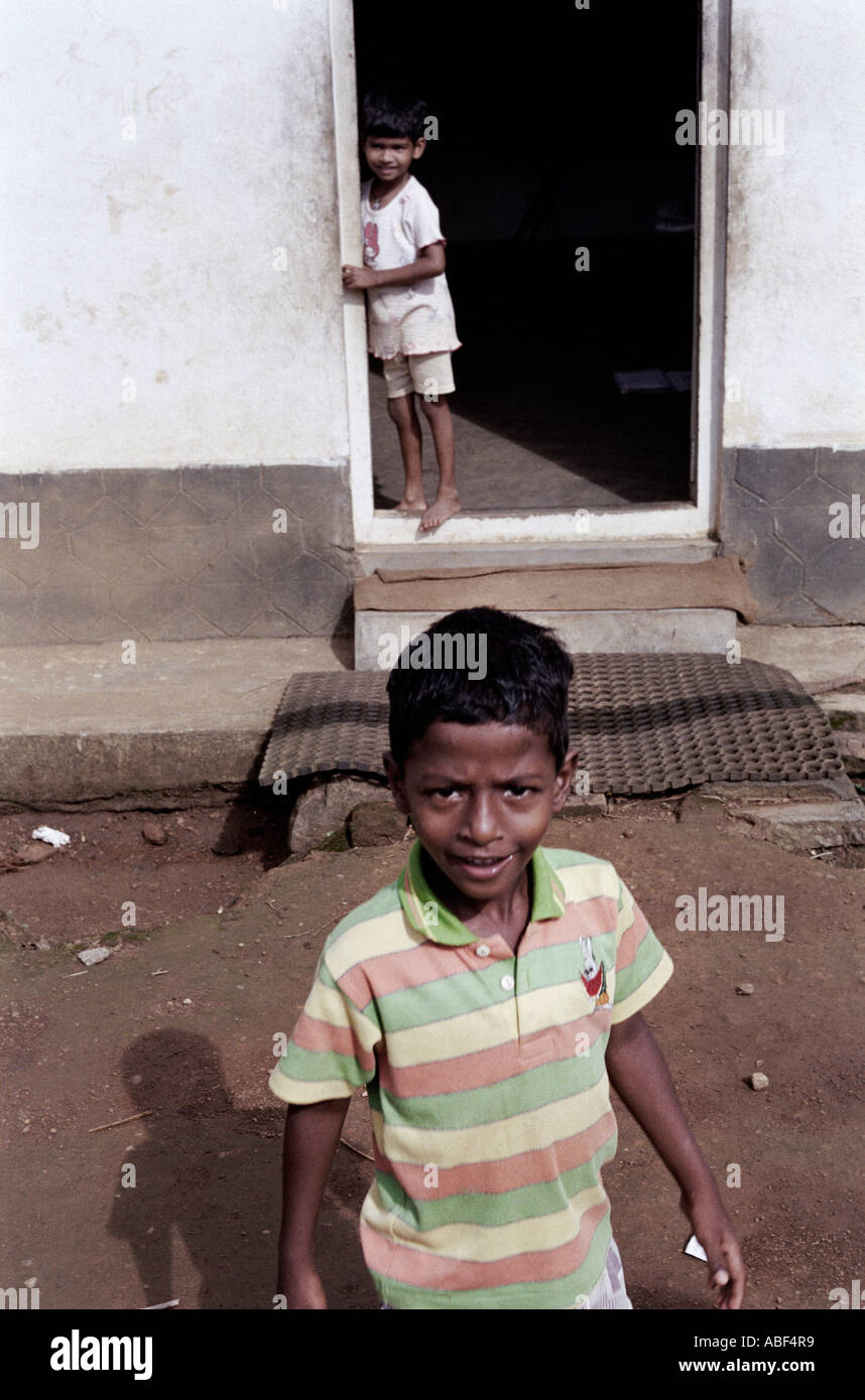 Two boys posing for camera in an Indian slum Stock Photo - Alamy