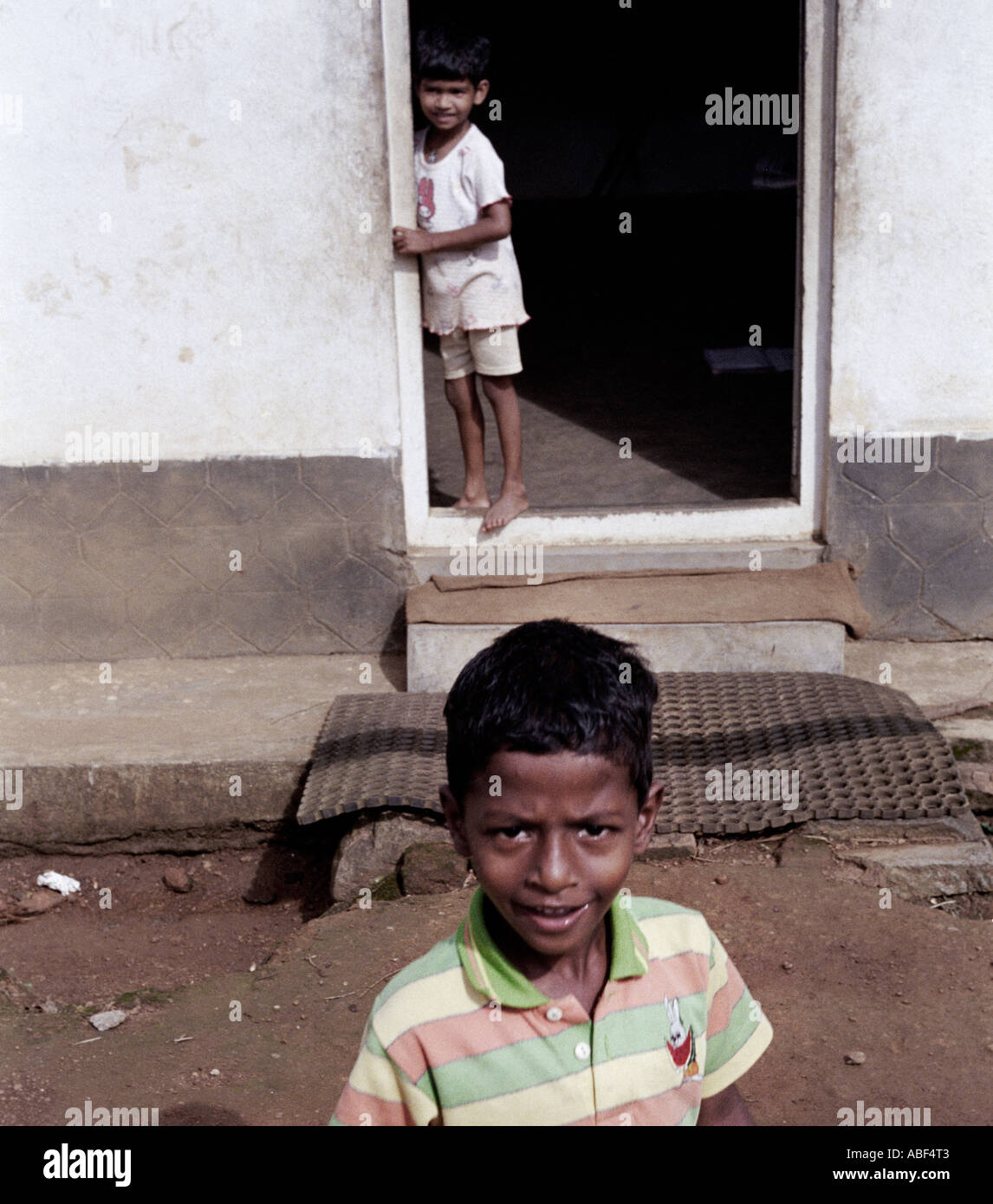Two boys posing for camera in an Indian slum Stock Photo - Alamy