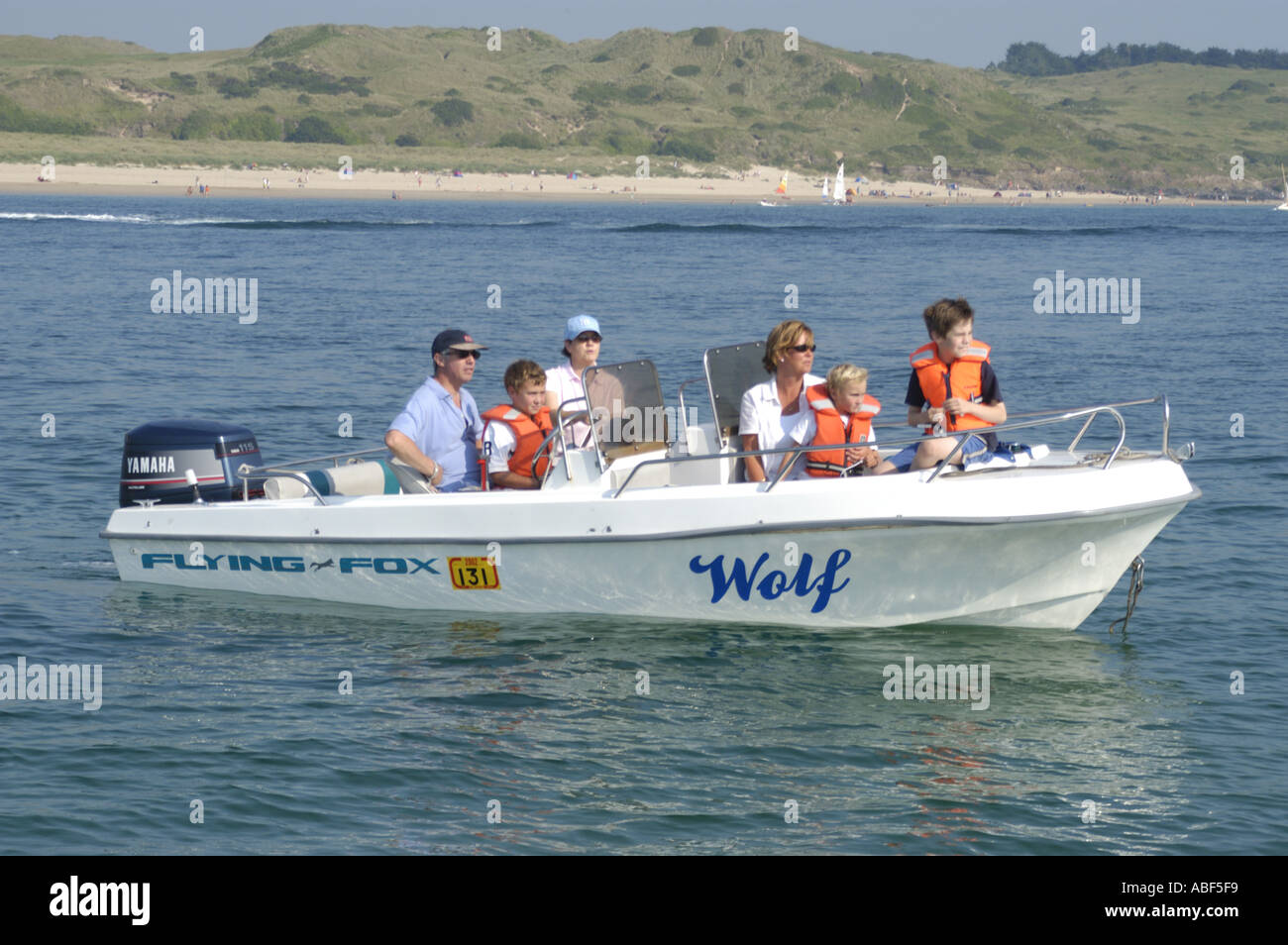 3183 family in speed boat Stock Photo - Alamy