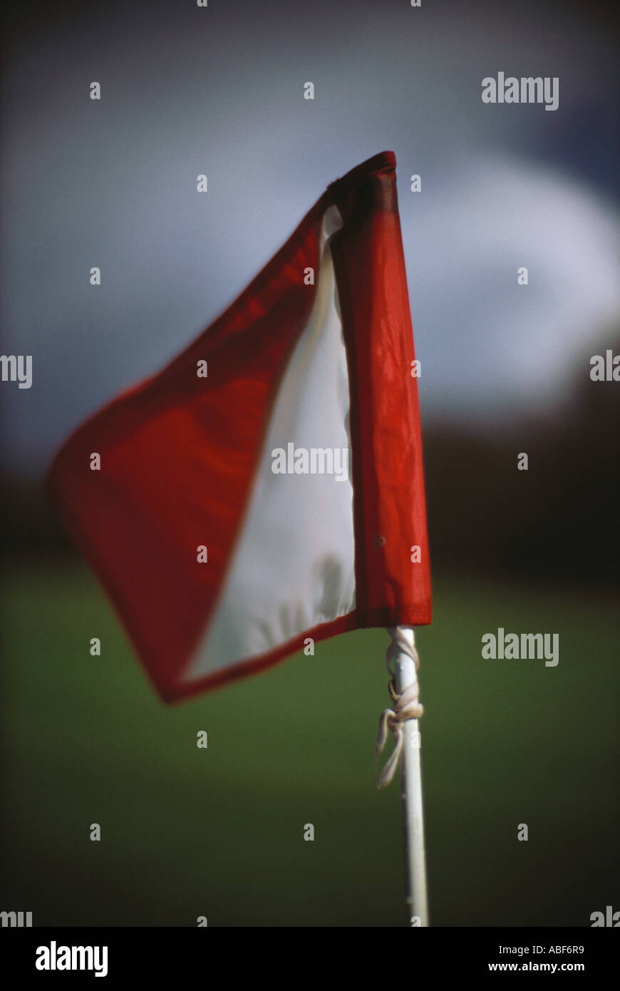 Impressionistic image of golf hole flag wimbledon common london uk ...