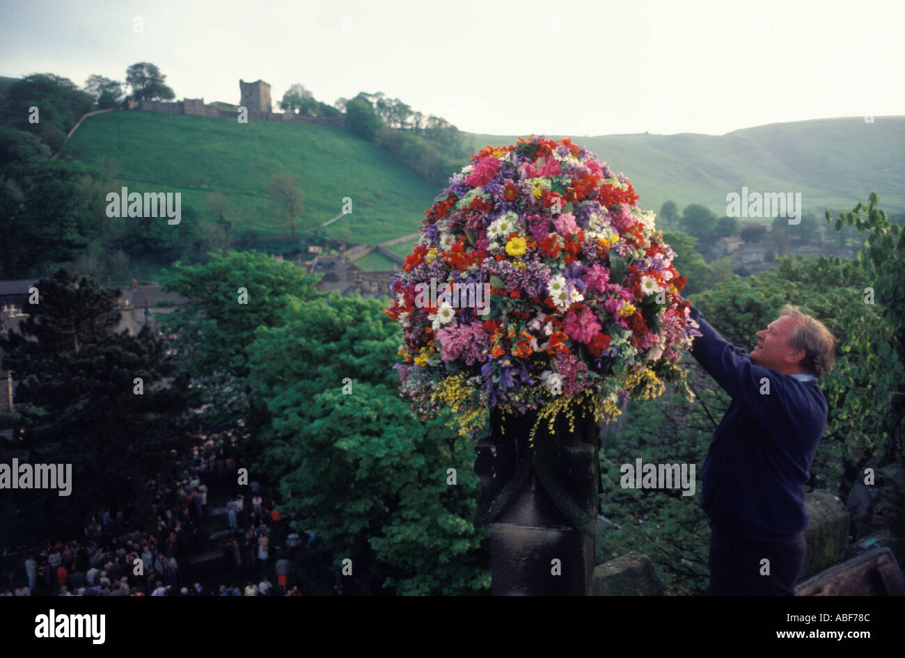 Castleton Garland Day. A garland of flowers on the tower of St Edmunds ...