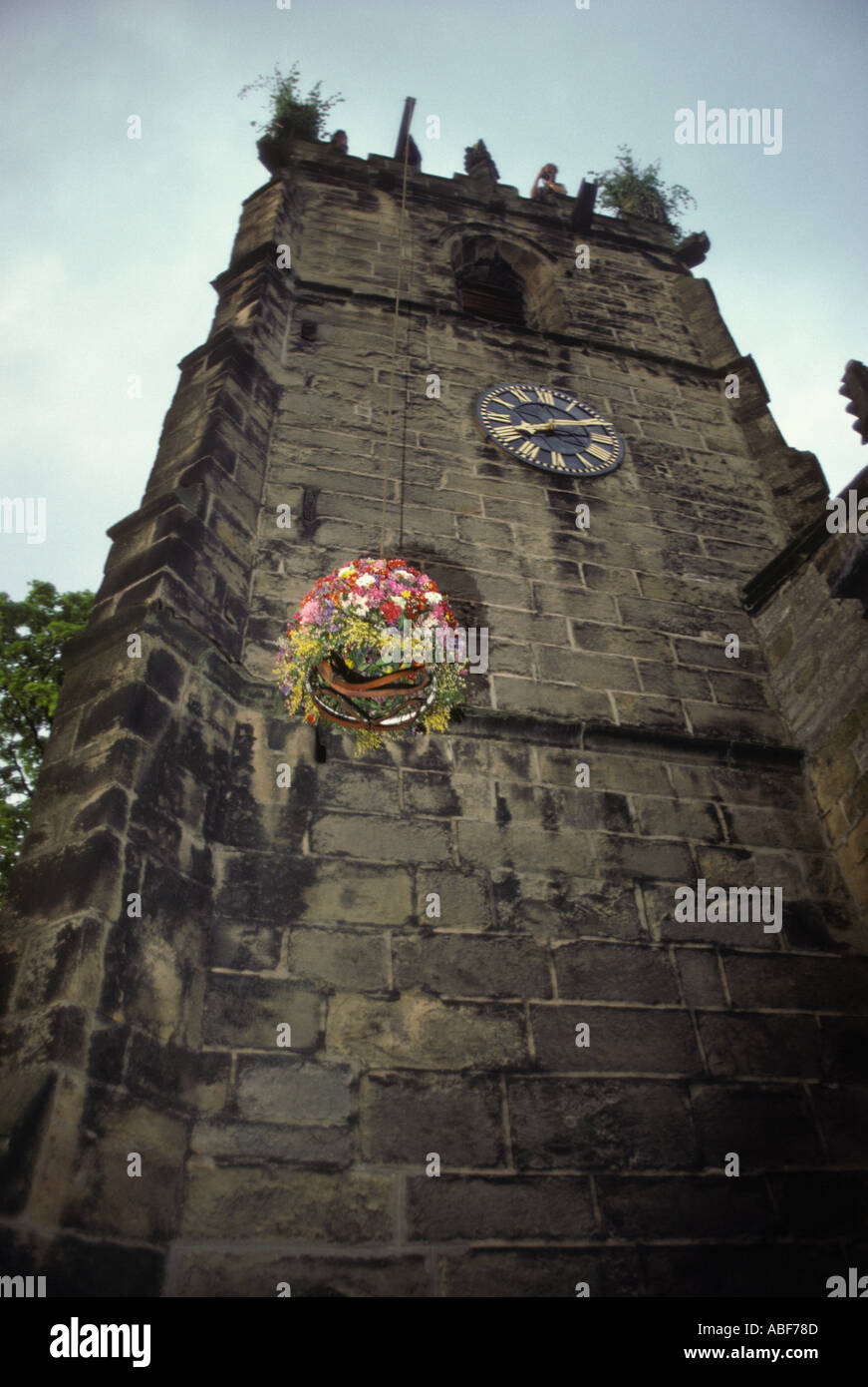 Castleton Garland Day. A garland of flowers on the tower of St Edmunds ...