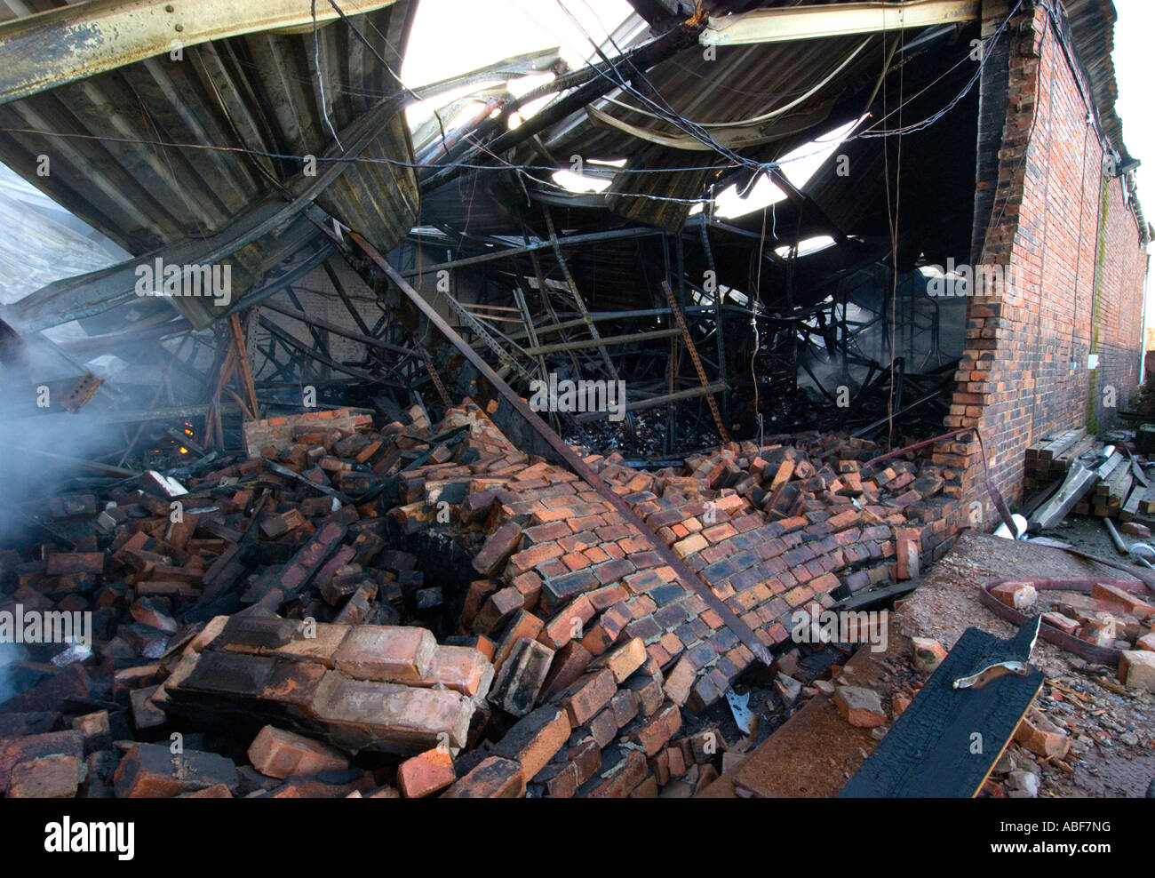 A burnt out warehouse that has collapsed following a major fire UK ...