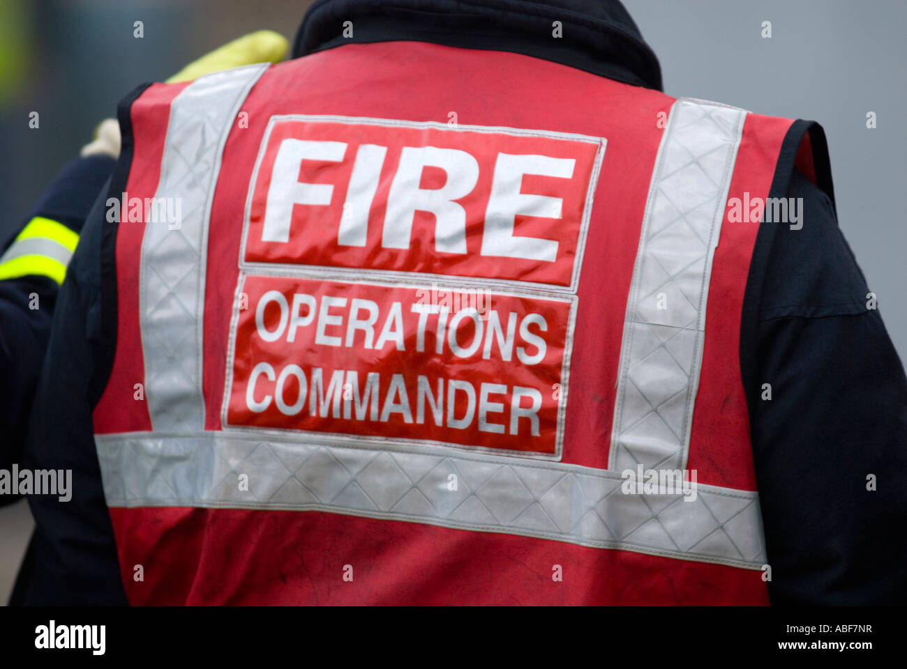 A Fire operations commander wearing high vis tabbard at incident in ...