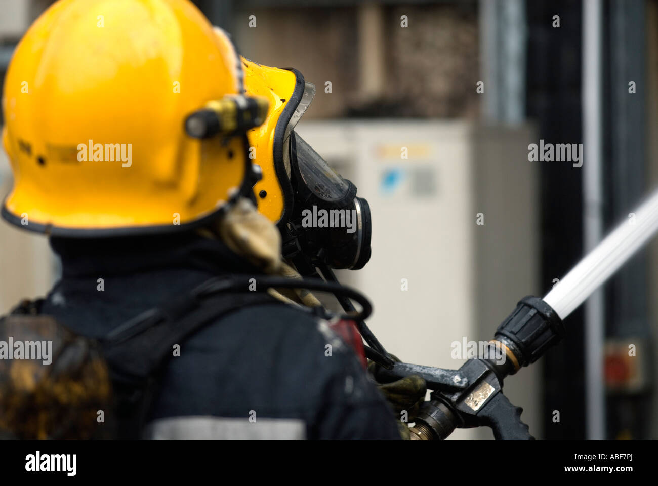 Fire two firefighters with main branch UK Stock Photo - Alamy