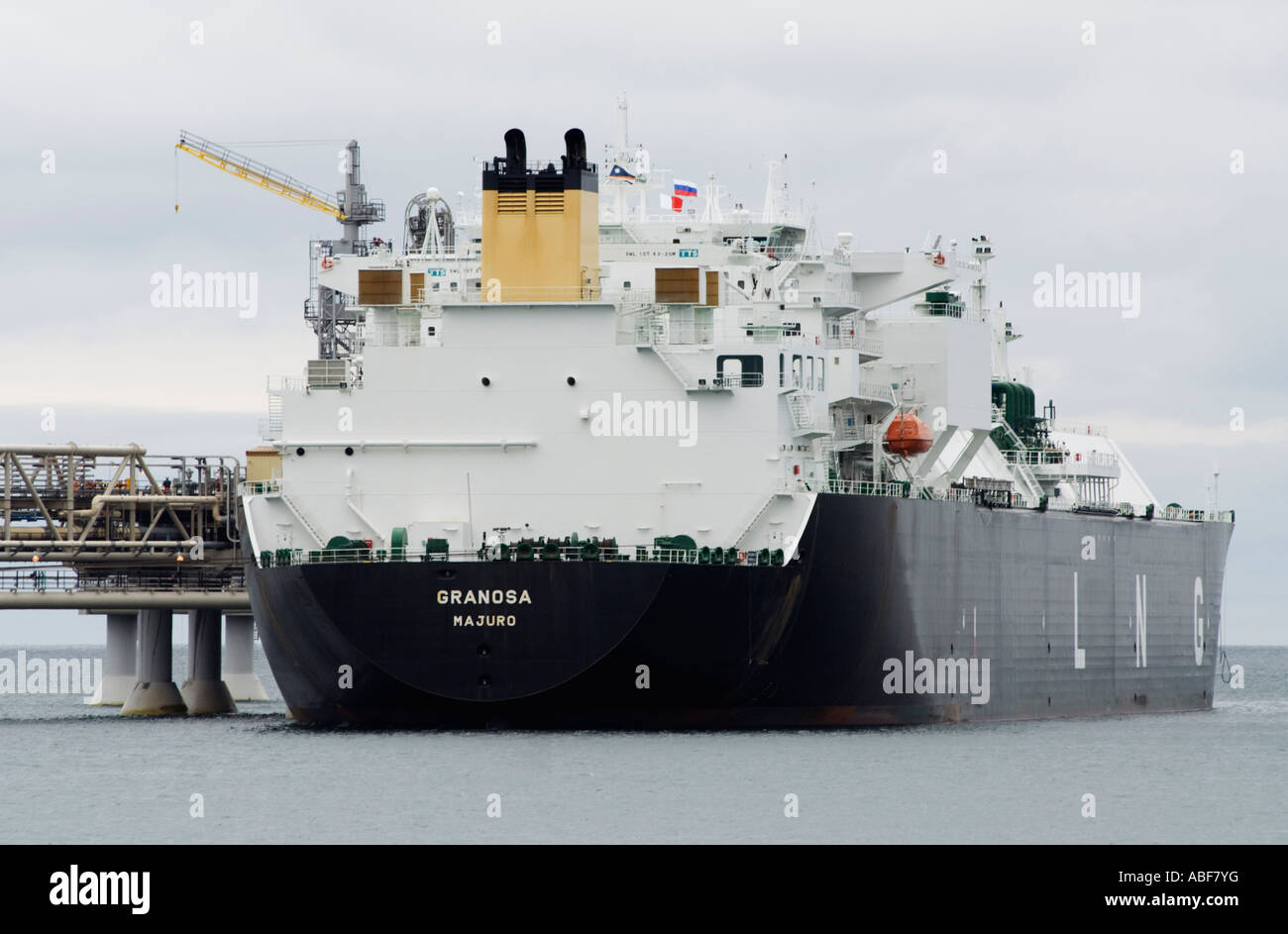 LNG tanker Granosa moored at jetty beside LNG Export terminal at ...