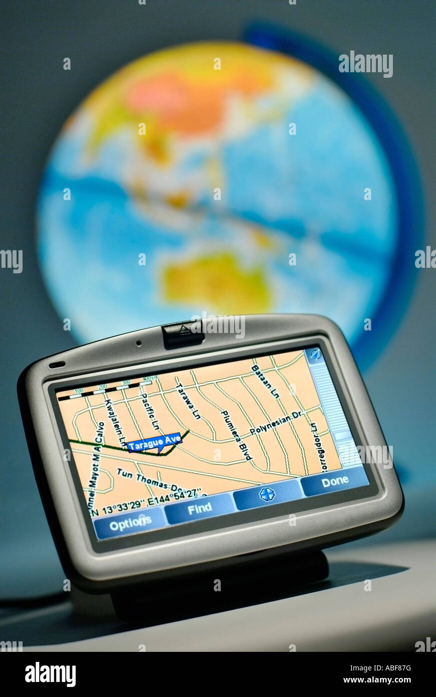 GPS SATELLITE NAVIGATION INSTRUMENT IN FRONT OF GLOBE Stock Photo - Alamy
