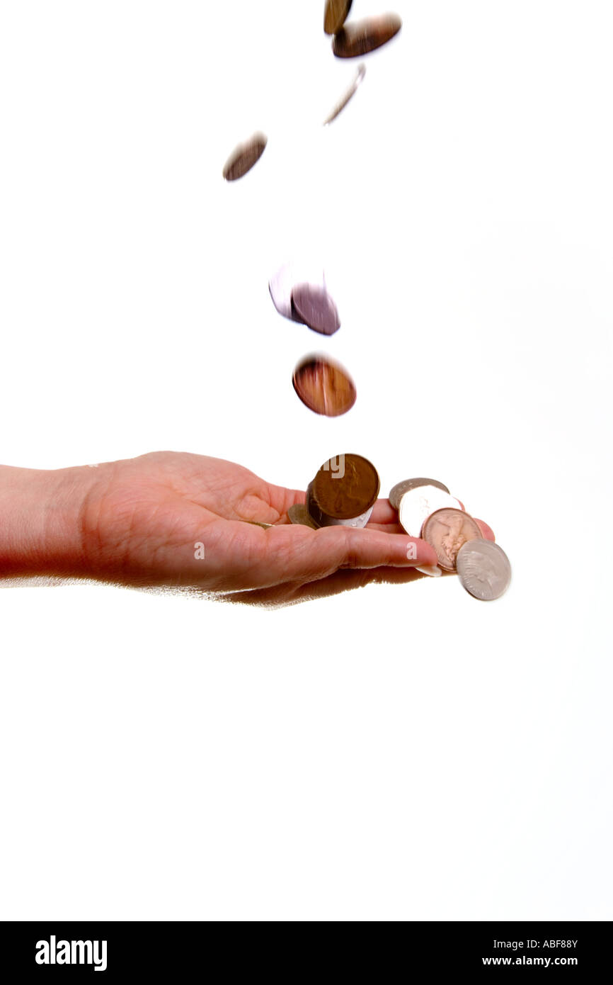 Catching falling coins Stock Photo - Alamy
