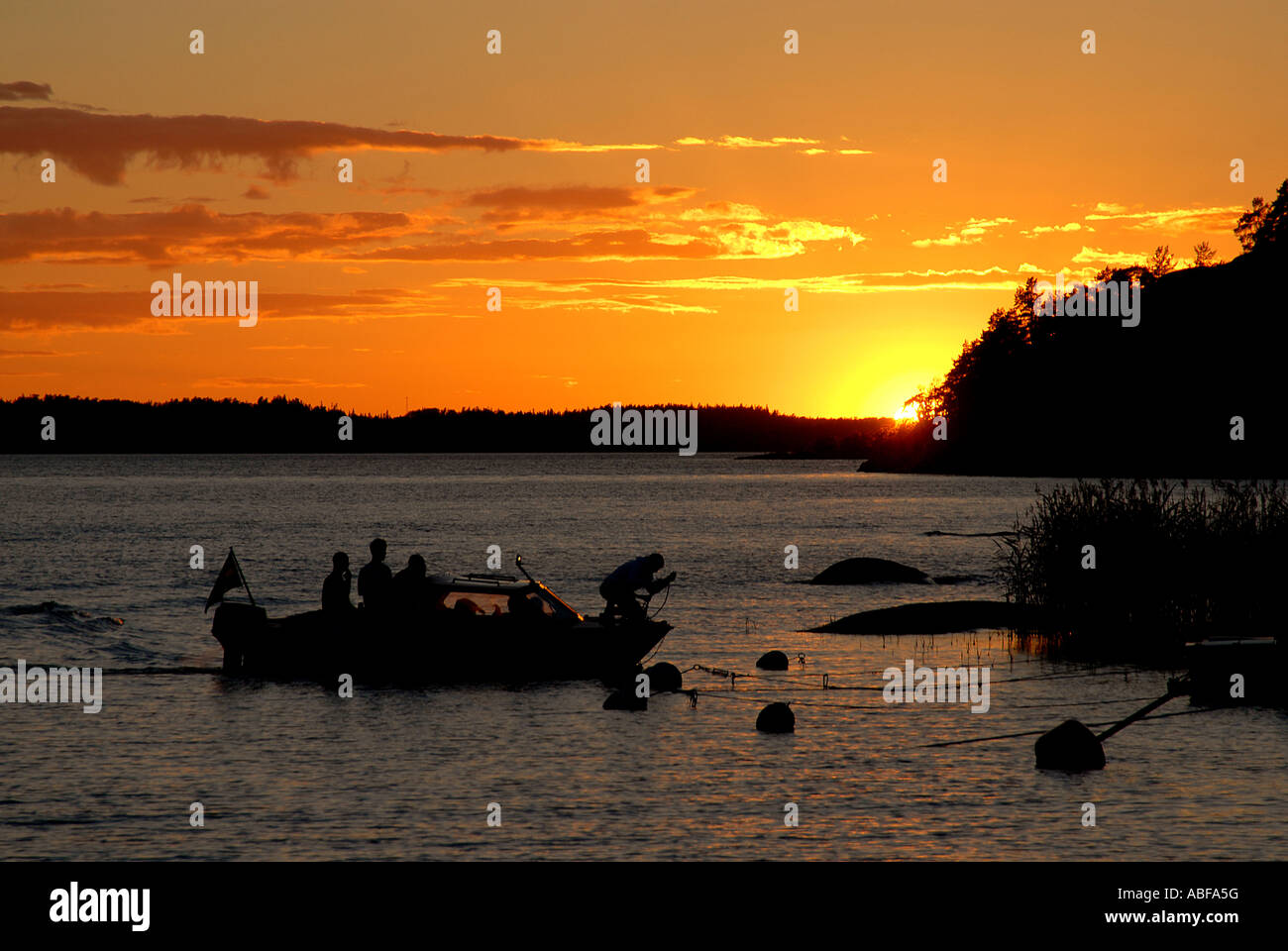 Party boat at sunset Stock Photo - Alamy