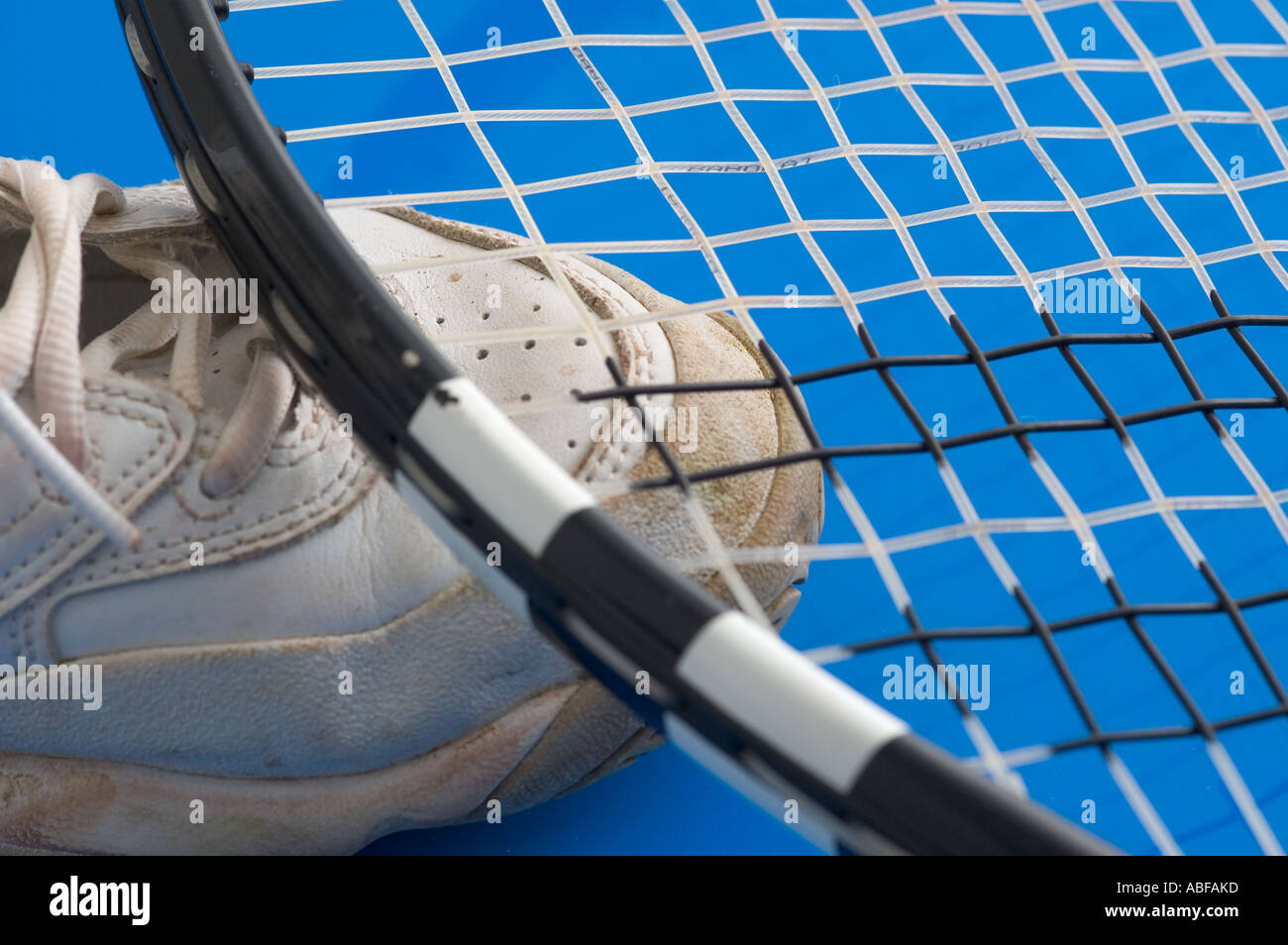 Tennis shoe and racket Stock Photo - Alamy