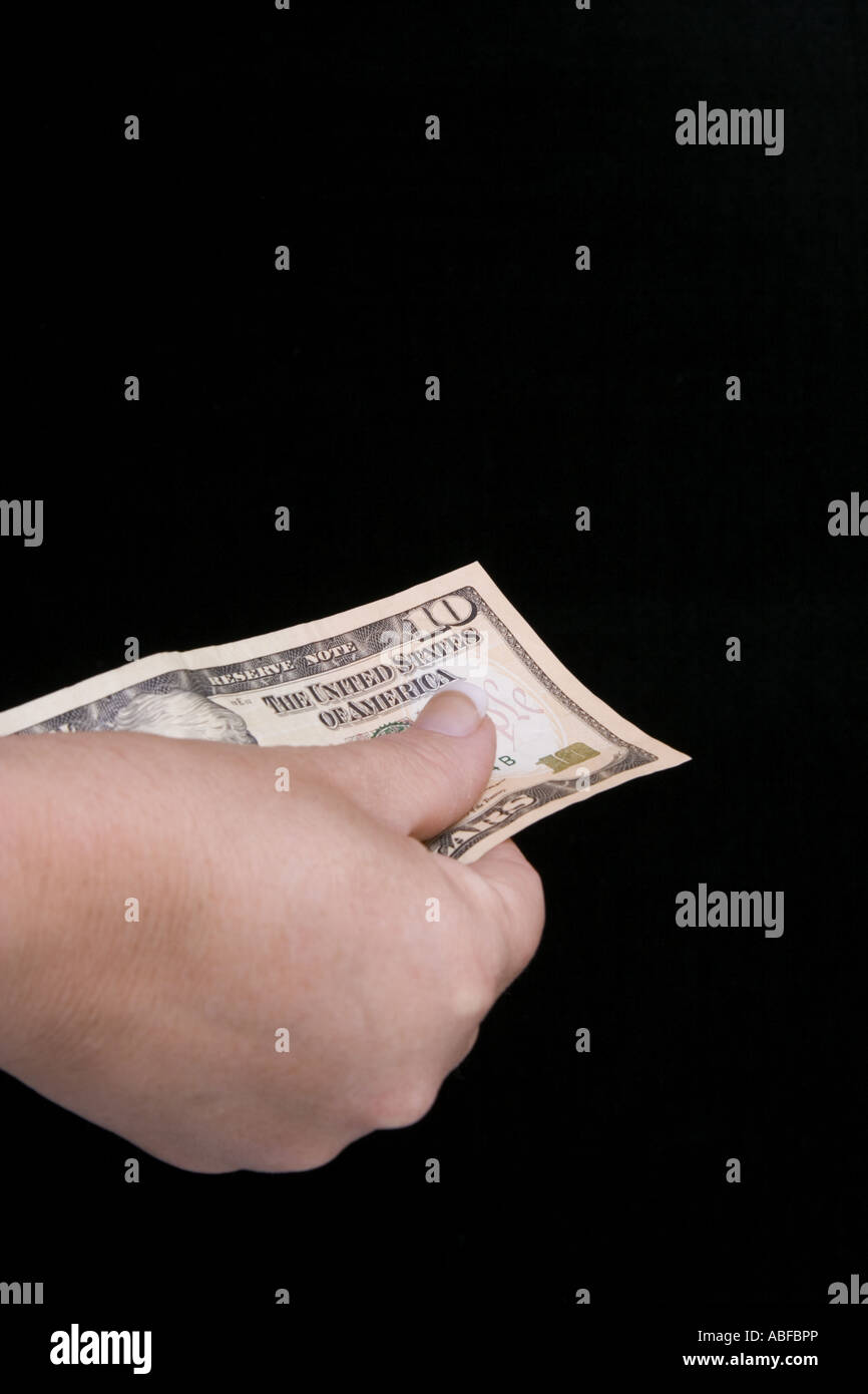 Female hand holding 10 dollar note Stock Photo - Alamy