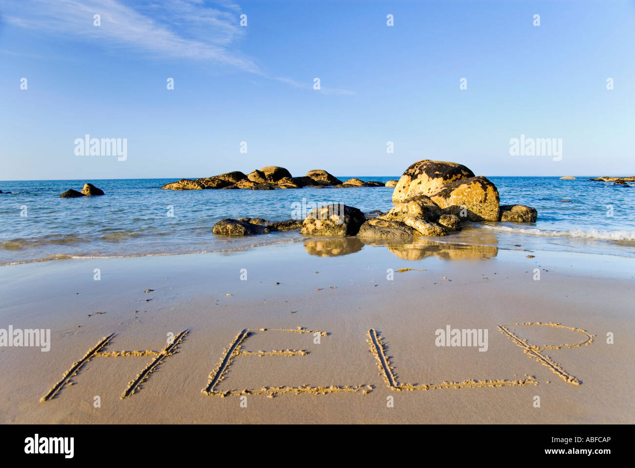 HELP written in sand on beach Stock Photo - Alamy