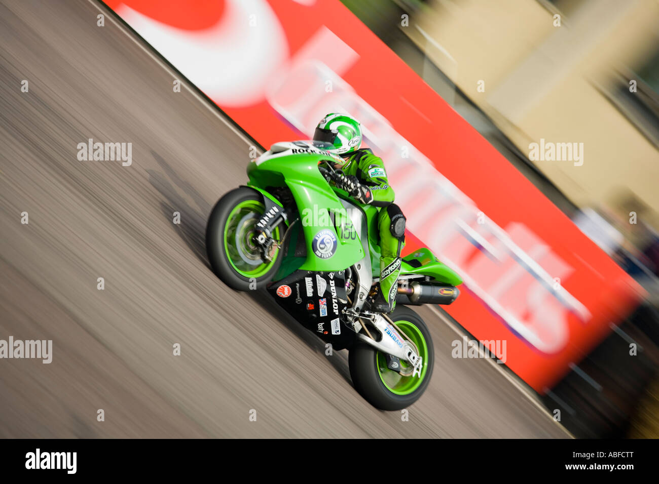 Panned Green racing motorbike action speed blur Stock Photo - Alamy