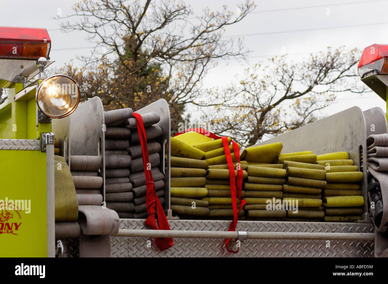 Neatly folded water hoses stored atop a fire engine Stock Photo - Alamy