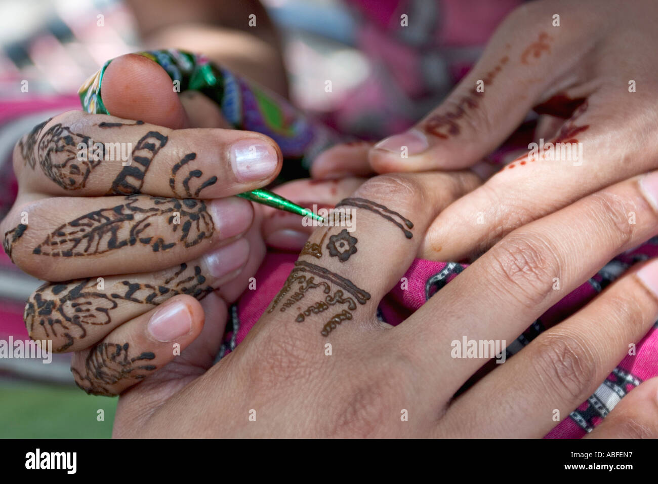 Applying decorative henna Stock Photo - Alamy
