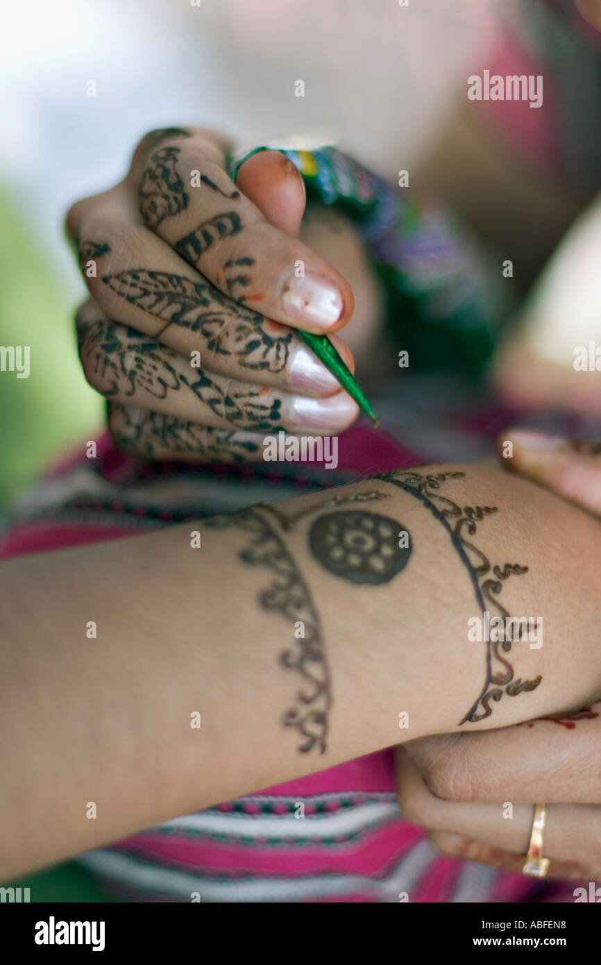 Applying decorative henna Stock Photo - Alamy