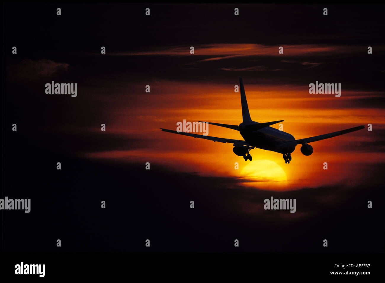Aircraft flying into sunset Heathrow UK Stock Photo - Alamy