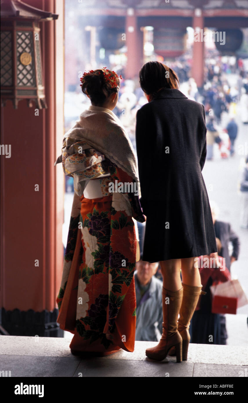 Two Japanese girls traditional versus modern waiting for their picture ...