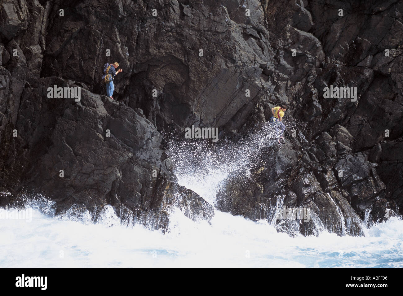 two climbers on the scottish isle of Pabbay risk getting wet on the ...