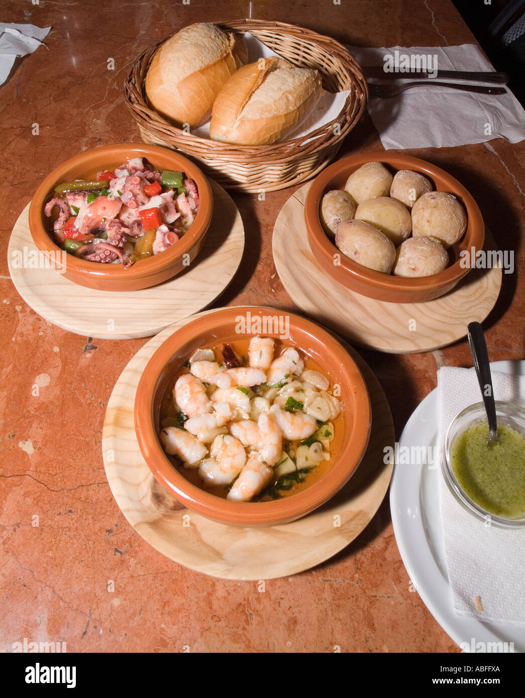 dh FOOD LANZAROTE Tapas dishes Canary potatoes squid garlic prawns ...