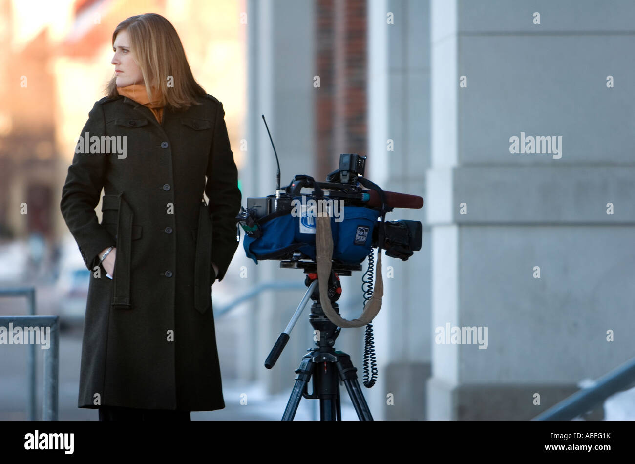 A television news reporter filming footage at the University of ...