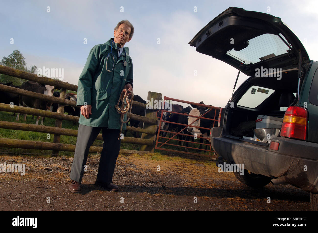 A vet pictured on a farm with his car Stock Photo - Alamy