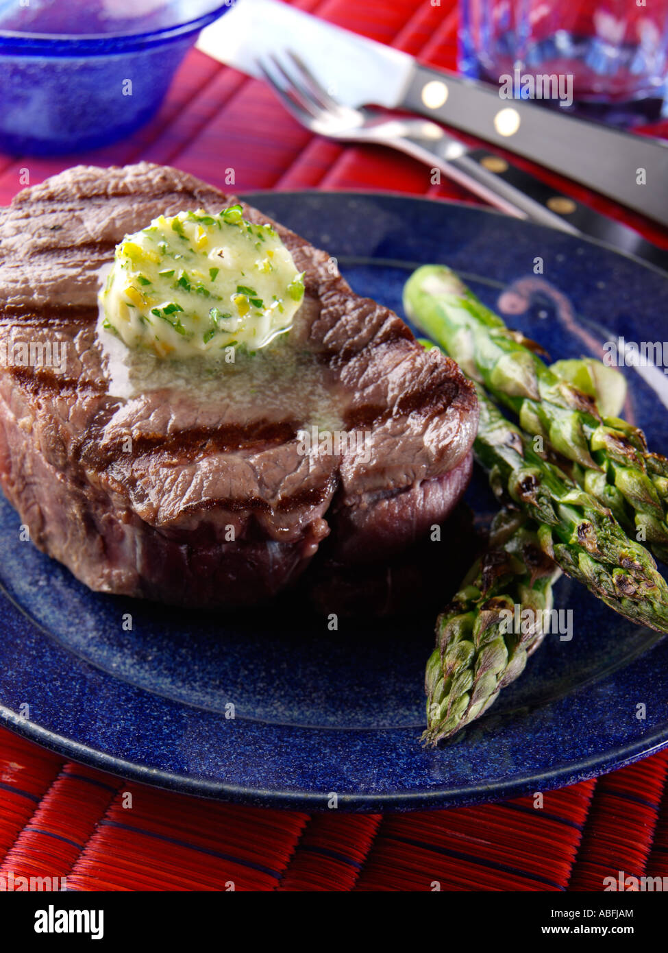 A plate of filet mignon and grilled asparagus editorial food Stock ...