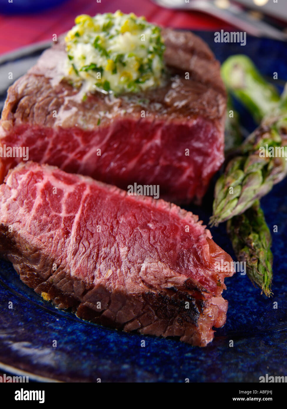 A plate of filet mignon steak and grilled asparagus editorial food ...