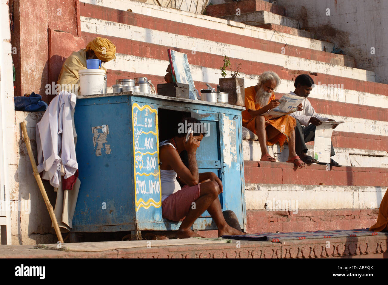 Chai Wallah and men on the Ghats in the early morning, Varanasi, India ...