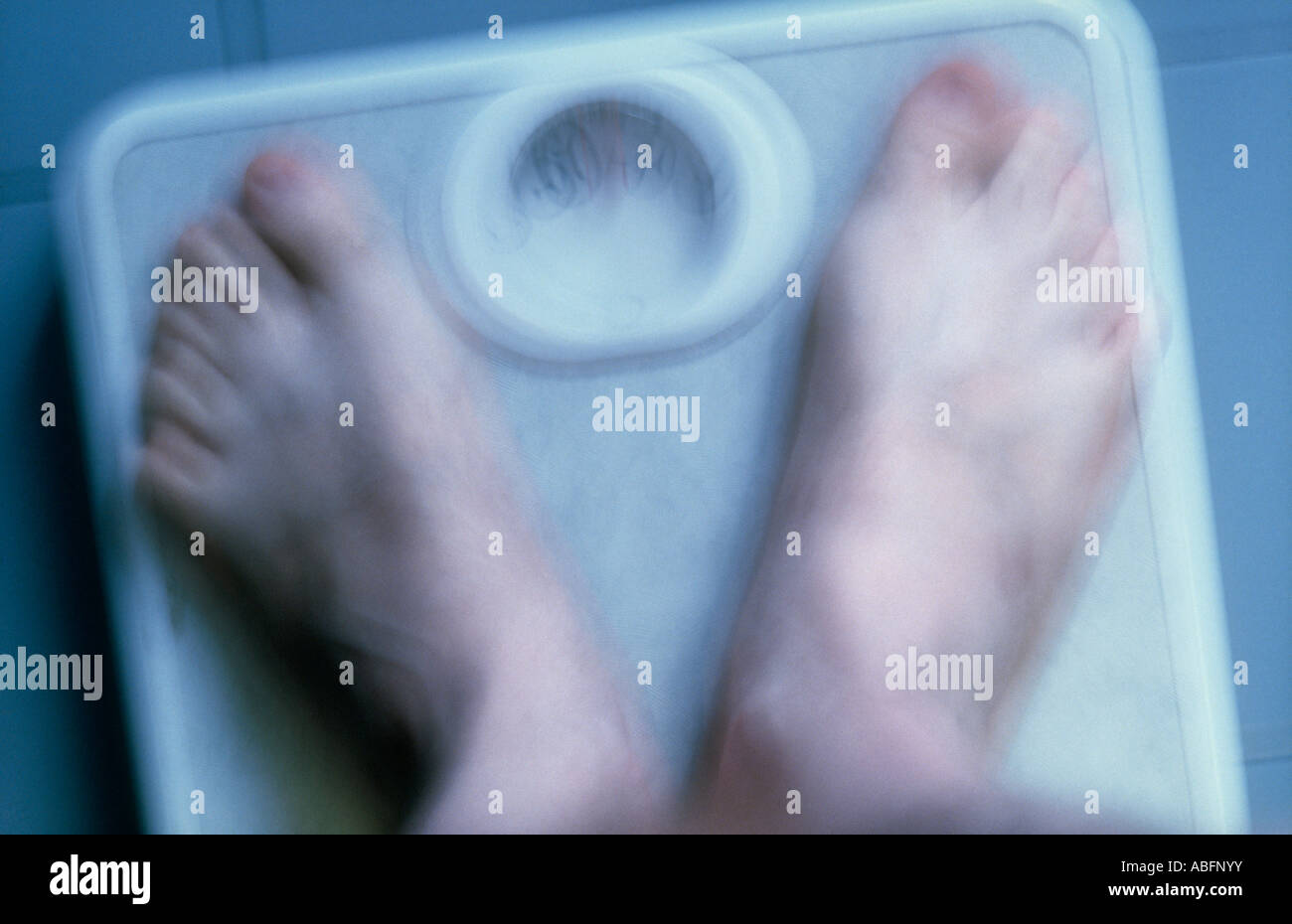 FEET ON WEIGH SCALES BALANCE Stock Photo - Alamy