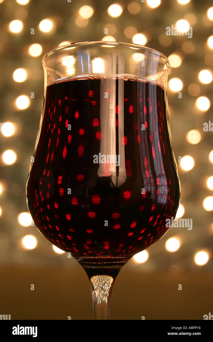 Red wine in glass against sparkly background Stock Photo - Alamy