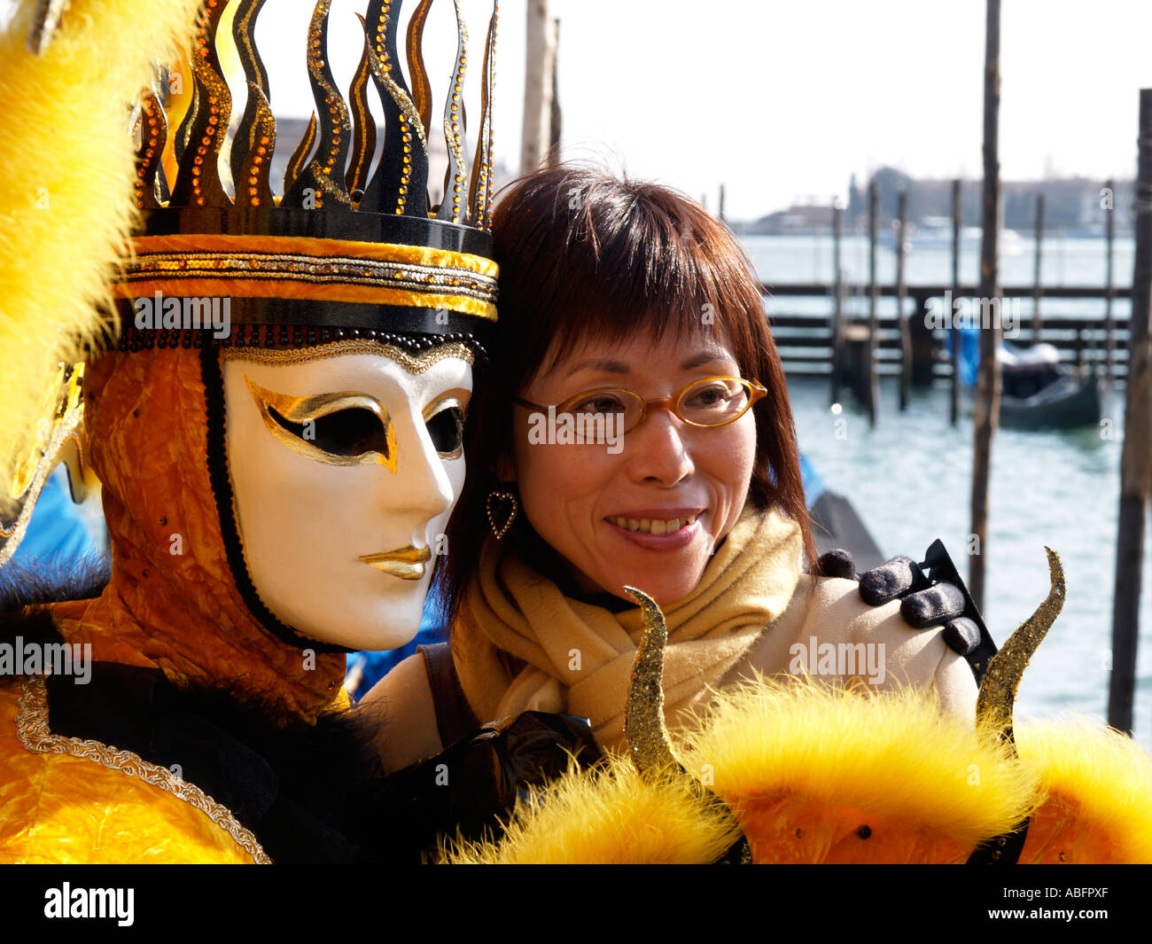 Japanese tourists posing for photograph with carnival reveller Venice ...